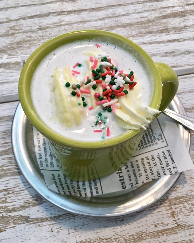 Not your childhood hot chocolate! This festive cup of liquid joy comes dressed for the party with sprinkles and whipped cream.