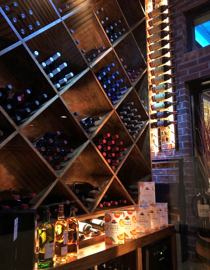 Wine bottles nestled in their wooden homes, waiting for their moment to shine. The perfect liquid companions for your seafood adventure.