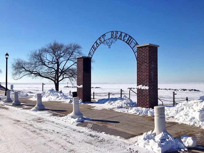 Winter's icy grip transforms the "EAST BEACH" entrance into a portal to Narnia, with Lake Erie frozen into a vast white wilderness.
