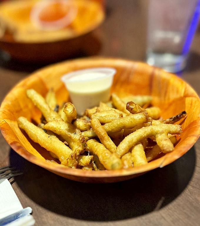 Crispy zucchini fries with dipping sauce&mdash;because sometimes you need to pretend you're eating vegetables while still enjoying deep-fried goodness.