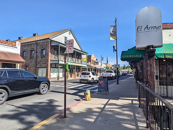 El Arroyo and historic storefronts create a streetscape where window shopping becomes an actual afternoon activity rather than just a euphemism for browsing online.