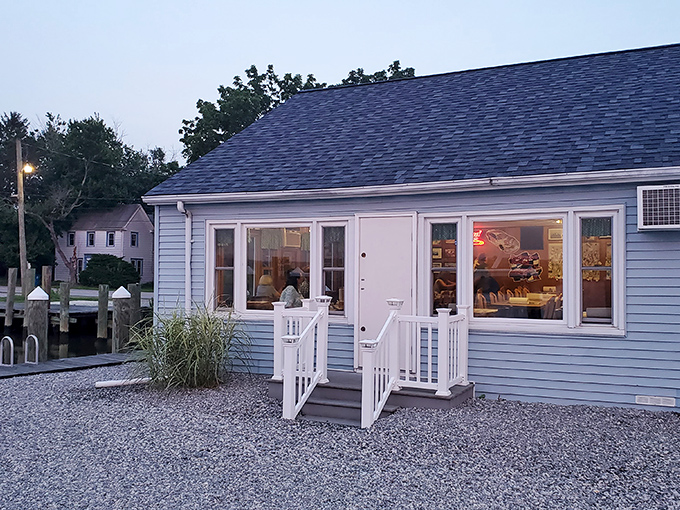 As evening approaches, the simple blue building glows with promise&mdash;like a beacon signaling to hungry travelers that authentic seafood awaits within.