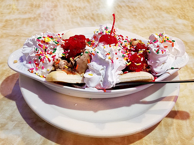 When your dessert needs its own zip code. This banana split comes with sprinkles, cherries, and guaranteed happy memories.