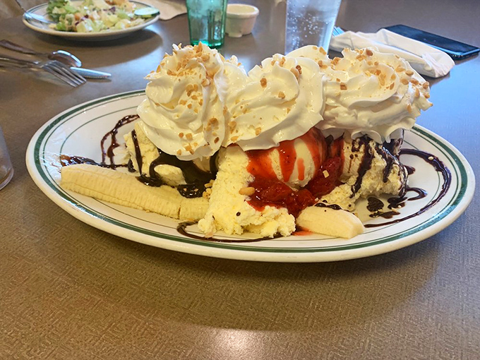 A banana split that doesn't just end your meal&mdash;it celebrates it. Those whipped cream peaks, chocolate drizzle, and toasted coconut flakes are pure joy on a plate.