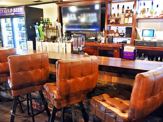 Those leather bar stools have supported the weight of countless important decisions, like "Should I order another round?" (The answer is always yes.)