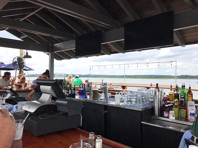 A waterfront bar that understands the fundamental truth: drinks taste better when served with a side of spectacular views.
