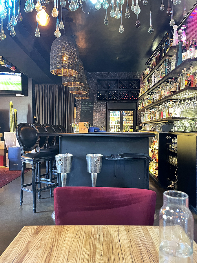 The bar at Elvira's isn't just stocked&mdash;it's a liquid library of tequila and mezcal, with pendant lights creating the perfect mood for exploration.