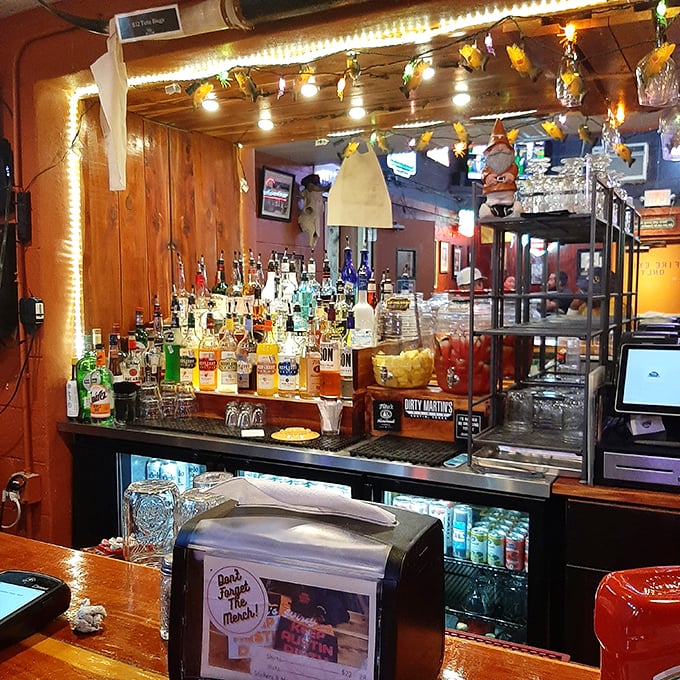The bar area glows with the warm promise of cold drinks&mdash;where stories get better with each sip and strangers become friends.
