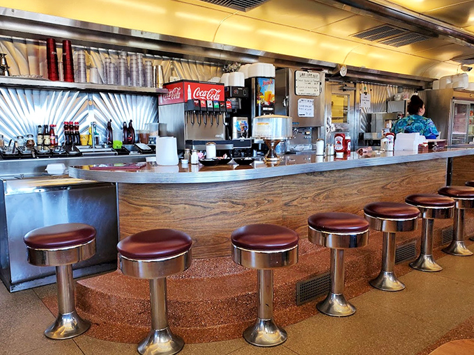 The diner's narrow galley setup creates an intimate experience where you're not just a customer—you're part of a temporary family of food enthusiasts.
