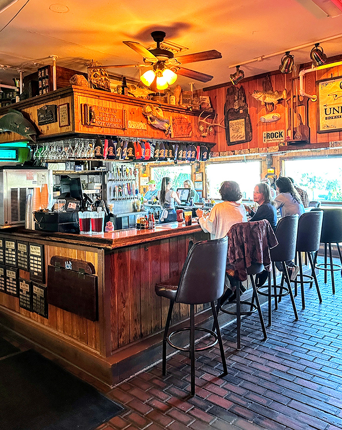 The bar where sea stories get better with each round. Those wooden walls have absorbed decades of laughter and tall fishing tales.