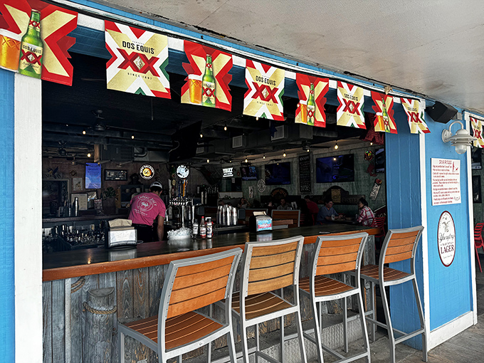The outdoor bar, where Dos Equis banners flutter in the sea breeze and wooden barstools await those wise enough to know where the locals drink.