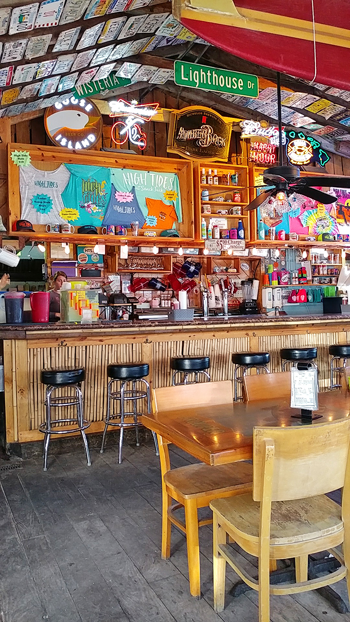 A bar that feels like it's been serving cold beers to happy beachgoers since time began. The license plates overhead each represent someone's story.