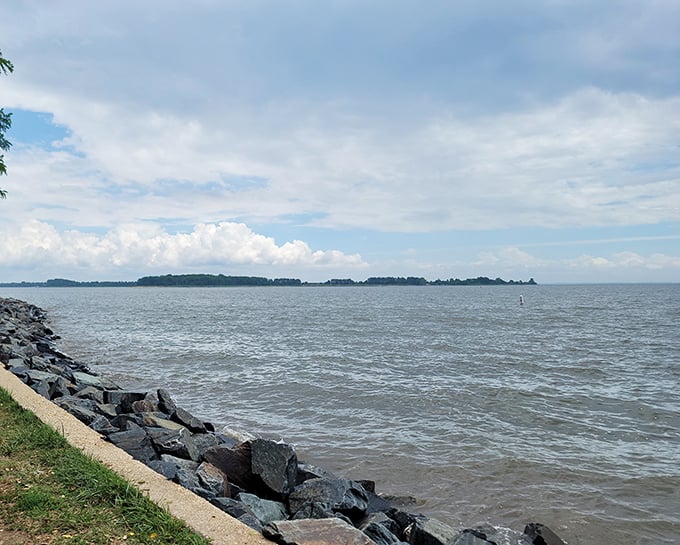 Where land meets water meets sky&mdash;Rocky Point's natural breakwater creates a rugged contrast to the peaceful horizon beyond.