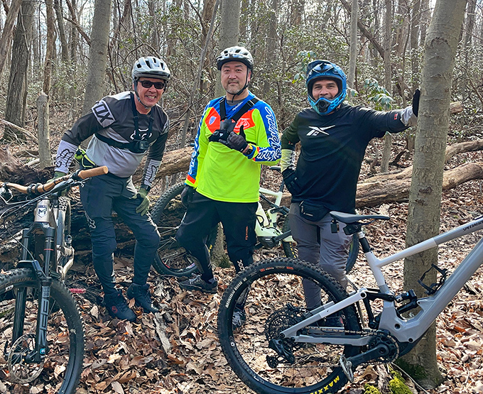 Mountain biking brotherhood in their natural habitat. The universal language of "Did you see that drop?" transcends all barriers.