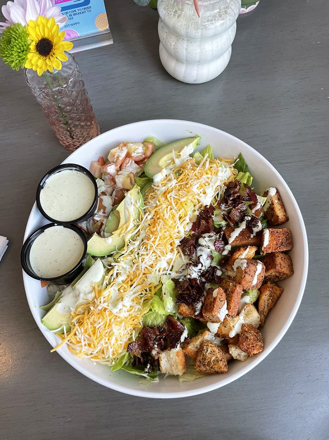 This isn't a salad—it's a carefully curated landscape where crisp lettuce, cheese, and croutons coexist in perfect harmony.