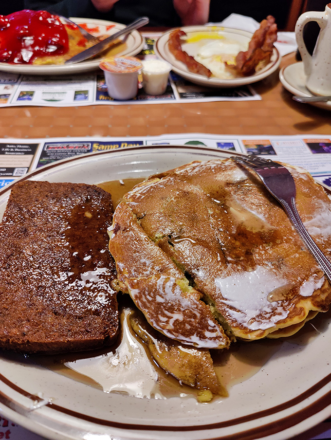 Pancakes so perfectly golden they belong in a museum. But they're better in your stomach, especially with that river of syrup.