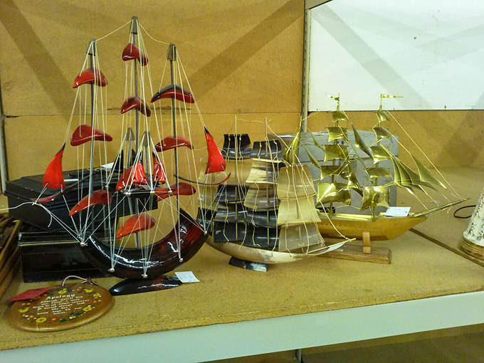 These miniature sailboats never braved actual seas, but they'll navigate the choppy waters of your living room decor with vintage flair.