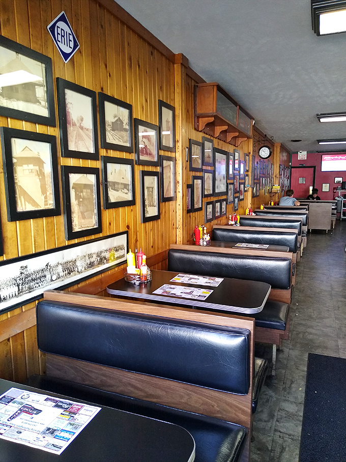 Classic booths that have cradled generations of diners, beneath walls that chronicle Huntington's history one framed photograph at a time.