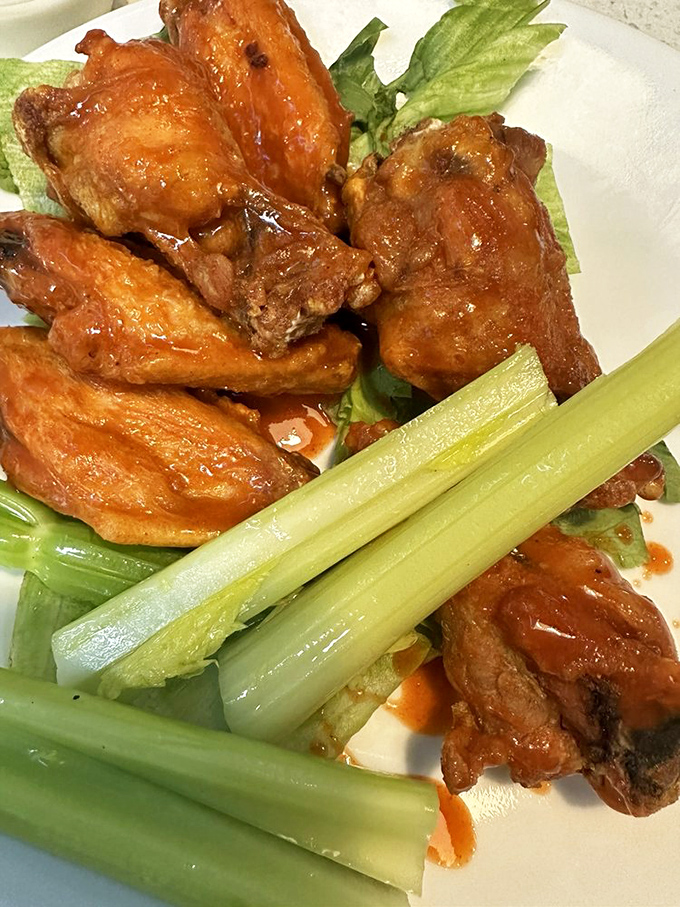 Buffalo wings with enough sauce to make you consider whether napkins should be sold by the roll here.