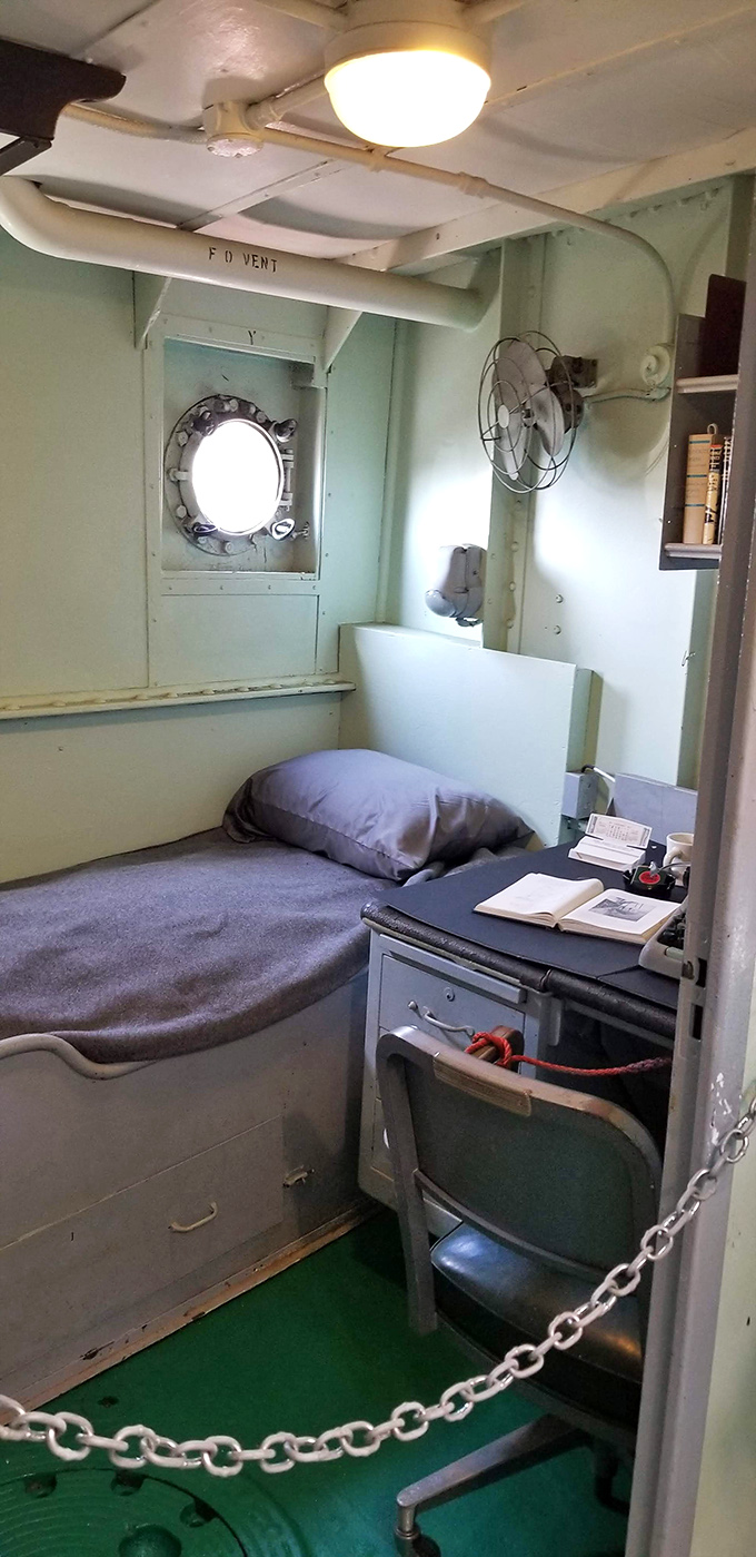 Crew quarters were cozy at best—this compact cabin with its porthole view and simple furnishings defined "efficiency" long before tiny houses were trendy.