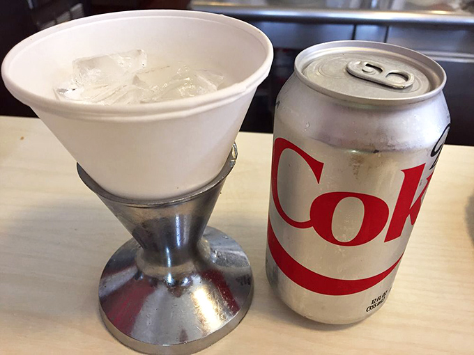 Diet Coke served in a metal holder that's seen more Hollywood history than most studio executives. Some traditions are worth preserving.