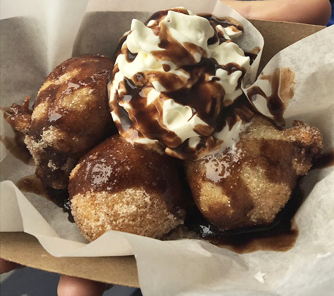 Cinnamon-dusted dough balls with whipped cream and caramel. These bite-sized wonders are what donut holes aspire to be when they grow up.