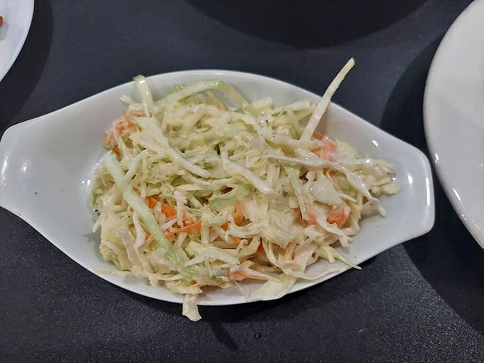 Coleslaw that knows its role&mdash;bright, crisp, and tangy enough to cut through rich seafood without trying to steal the spotlight.
