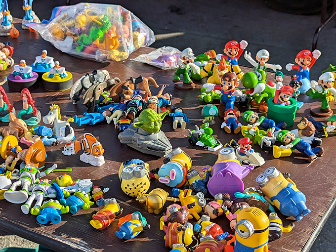 Toy story indeed! Mario, Minions, and friends create a plastic reunion of childhood heroes waiting for collectors to rescue them from flea market purgatory.