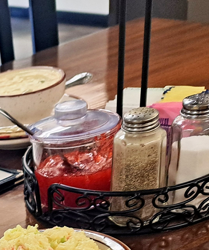 The condiment caddy&mdash;humble ambassador of customization. That homemade strawberry jam isn't just a spread&mdash;it's the secret weapon that elevates a simple roll to memorable status.