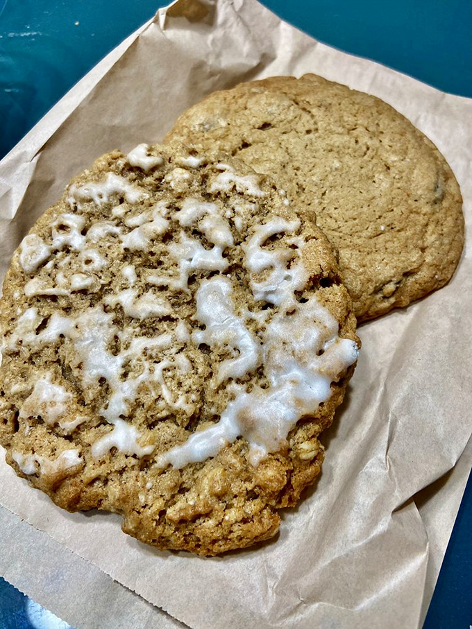 Oversized cookies with perfect glaze drizzles, because sometimes you need handheld happiness wrapped in parchment paper.