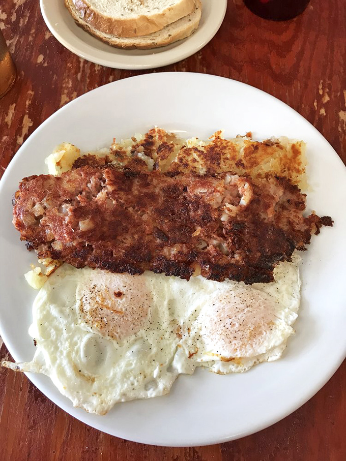 Corned beef hash with eggs&mdash;the breakfast of champions who understand that mornings deserve more than just a boring bowl of cereal.