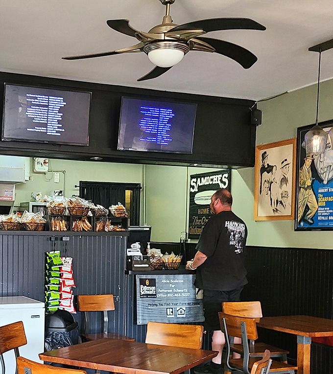 A ceiling fan spins lazily above the dining area while vintage posters transport you to an era when meals weren't interrupted by smartphone notifications.