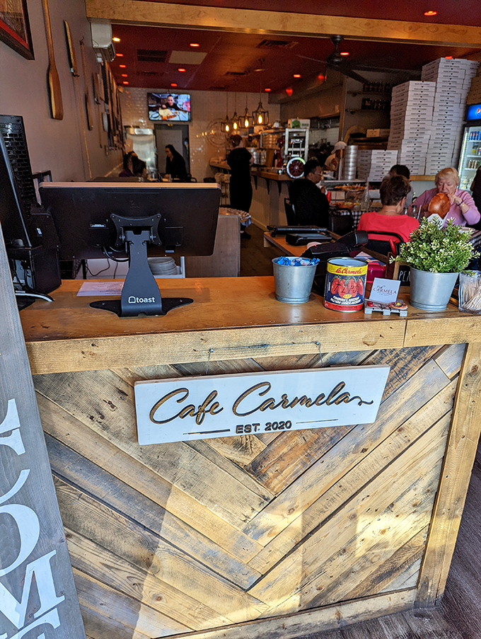 The rustic wooden counter tells you everything about Caf&eacute; Carmela's priorities&mdash;warmth, craftsmanship, and the kind of authenticity you can't fake.