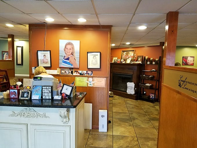 Family photos and warm wood tones create a homey atmosphere at the counter, where every guest is treated like a long-lost relative.