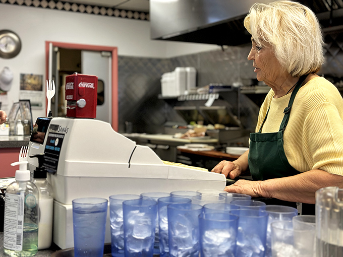 The command center of comfort food operations, where orders are called and coffee is poured with military precision.