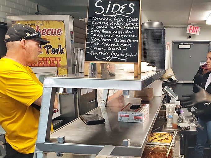 The chalkboard of sides reads like a southern comfort food manifesto. Smoked mac and cheese, country green beans, and cornbread casserole&mdash;no diet survives this list.