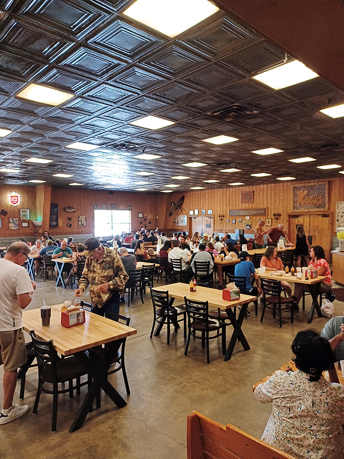 The dining room hums with the satisfied murmurs of pilgrims who've found what they were seeking: barbecue transcendence.