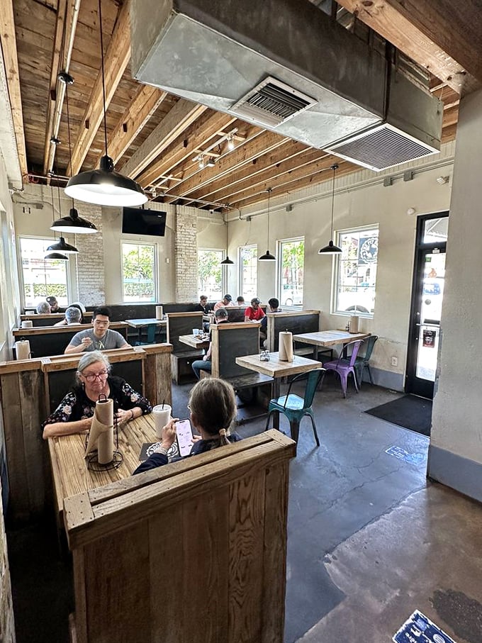 Happy customers savoring their barbecue bounty, proving that great food creates instant community and shared joy.