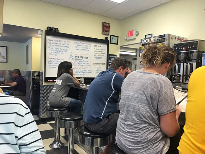 The counter seating—where diner magic happens. Solo diners become temporary neighbors, united by coffee and the hypnotic dance of short-order cooks.