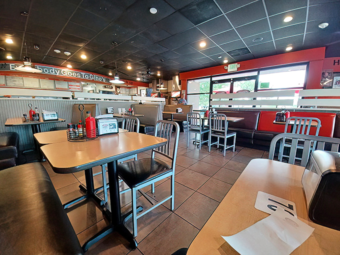 Where burger memories are made. The clean, comfortable dining area with its "Everybody Goes to Gino's" banner promises a meal worth lingering over.