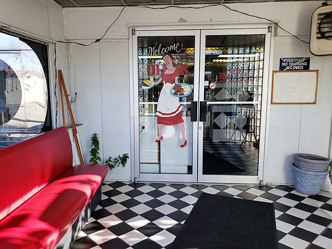 The entrance welcomes with vintage charm, where a painted waitress has been serving the same smile to generations of hungry Clevelanders.