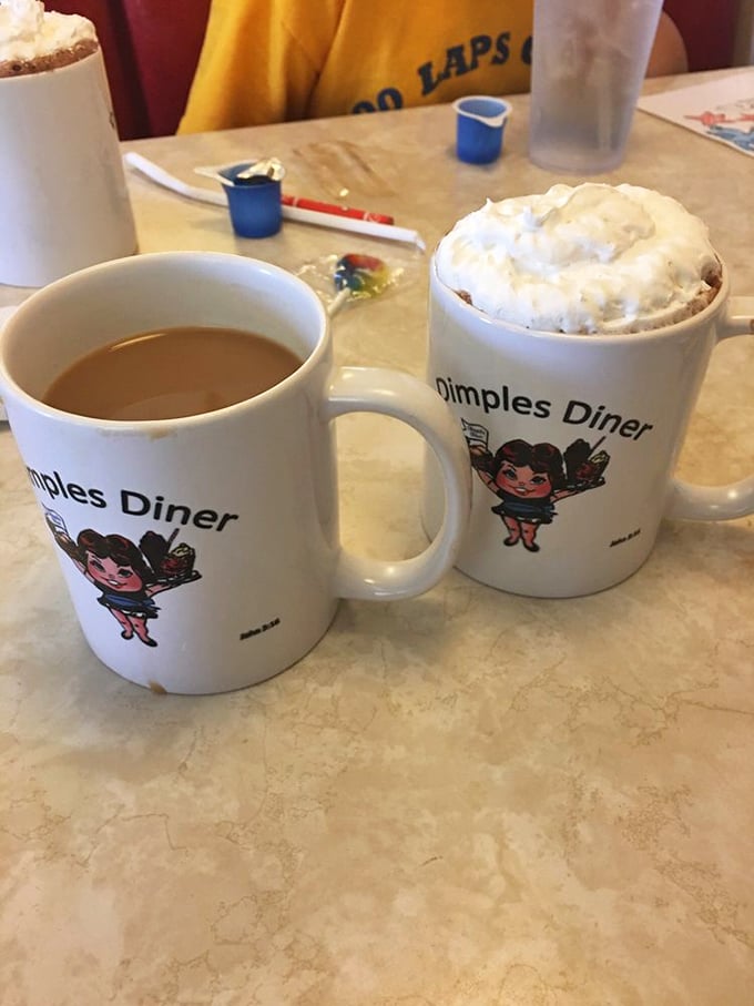 Coffee mugs that tell you exactly where you are, in case the food coma makes you temporarily forget. One black, one with whipped cream&mdash;life choices.
