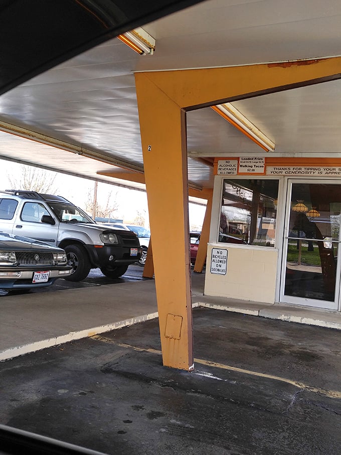 The classic drive-up service area, where your car becomes a dining room and every order arrives with a side of mid-century charm.