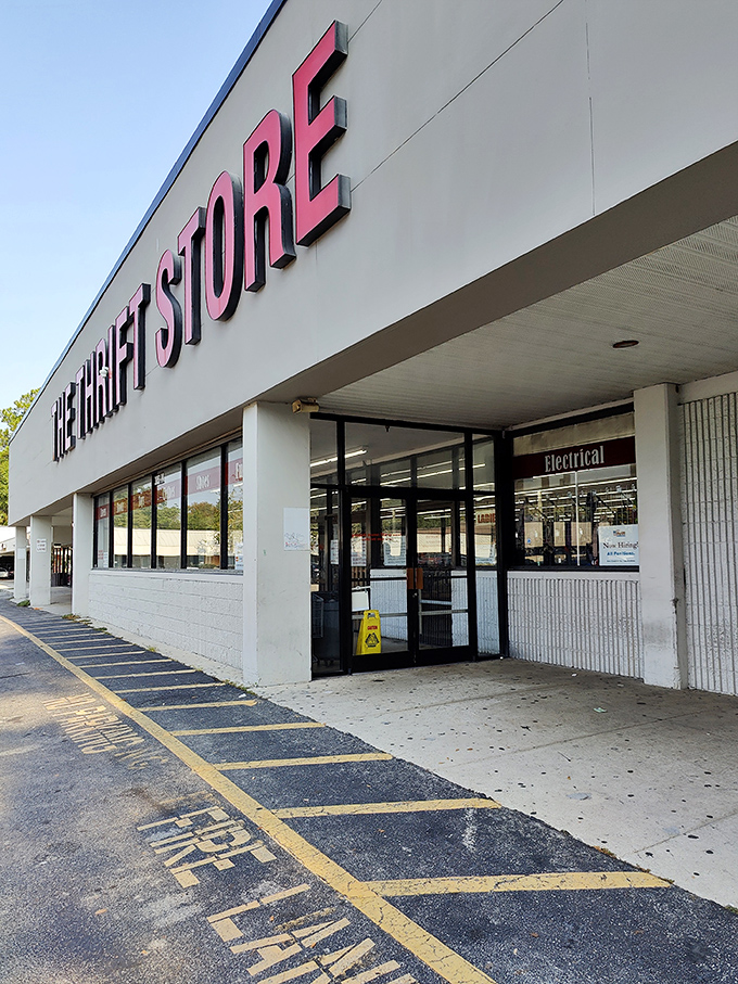 The entrance beckons like a portal to possibility. That "wet floor" sign might as well say "slippery slope to spending your afternoon treasure hunting."