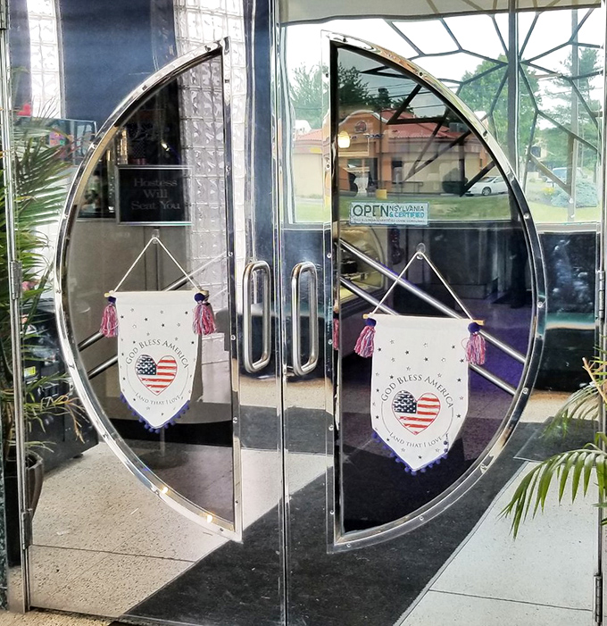 The distinctive circular entrance feels like passing through a portal to a simpler time when diners were the cornerstone of American community life.