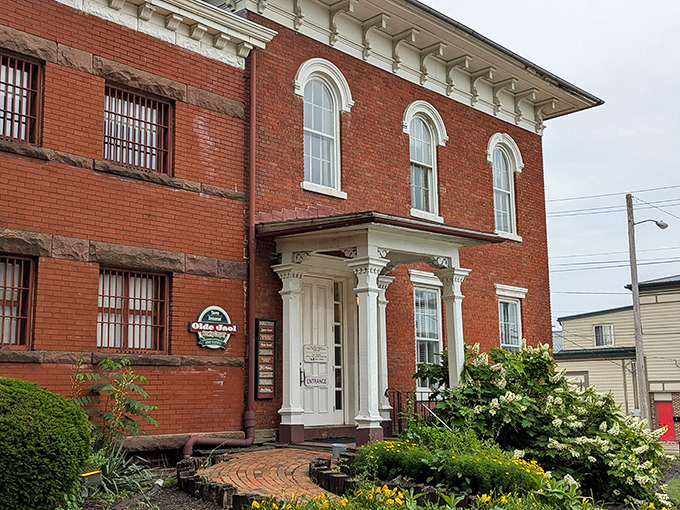 The entrance beckons with historic charm and landscaped beauty&mdash;a far cry from when it welcomed a very different kind of guest.