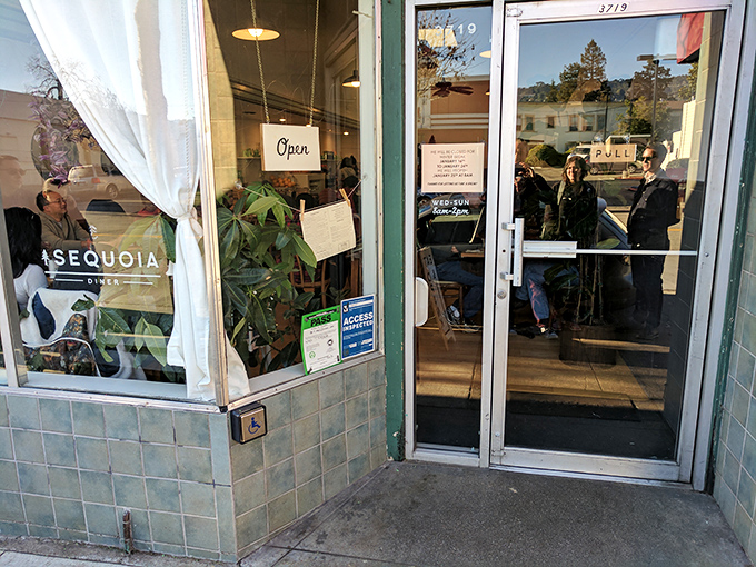 The "Open" sign&mdash;three simple neon letters that promise culinary salvation to the hungry masses lined up outside.