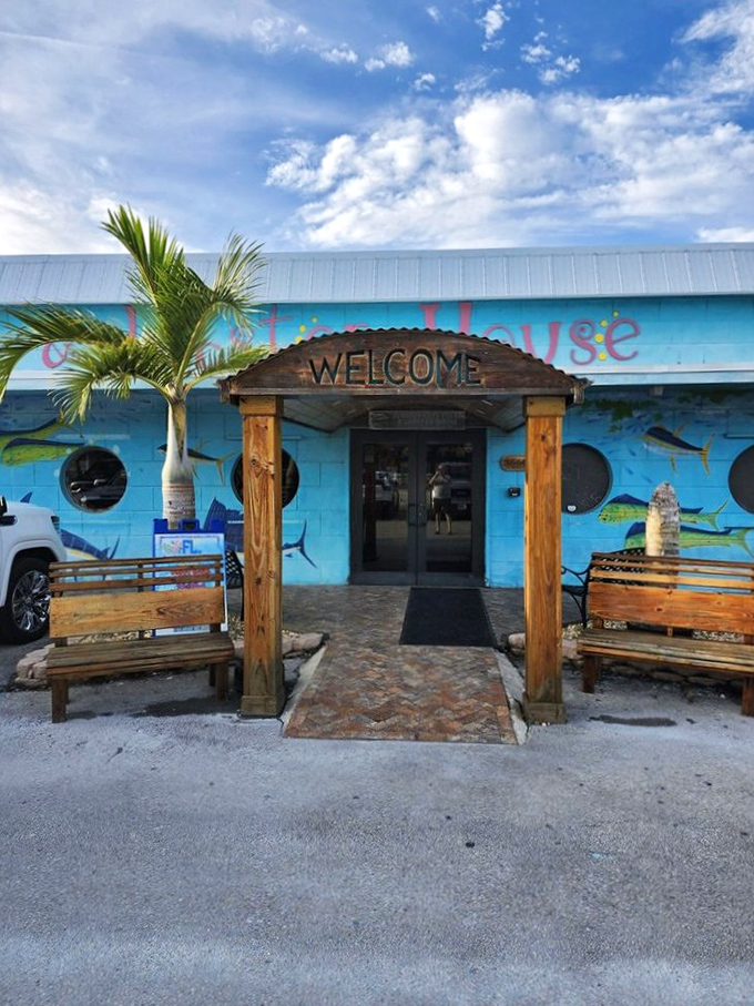 The entrance says "Welcome" but really means "Prepare for seafood euphoria." Wooden benches invite you to pause and build anticipation before the feast begins.