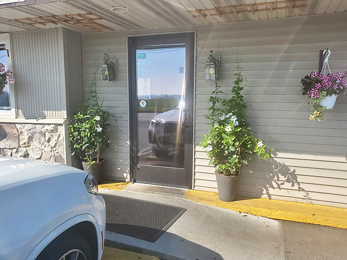 An entrance that says "Welcome home" even if you've never been here before. Those potted plants aren't just greenery—they're your first taste of Kountry Kitchen hospitality.