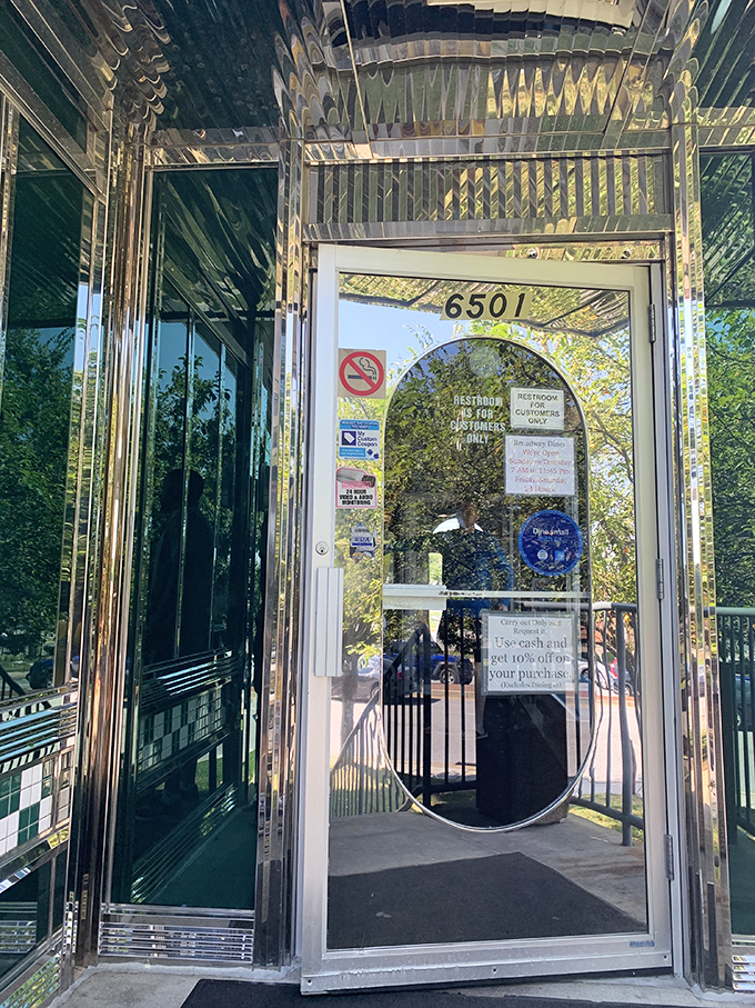 An entrance that says "Leave your diet at the door" with all the subtlety of its gleaming, mirrored finish.